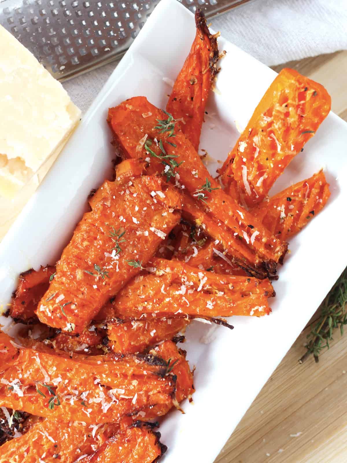 Smashed Carrots with Parmesan and Thyme - Bite On The Side